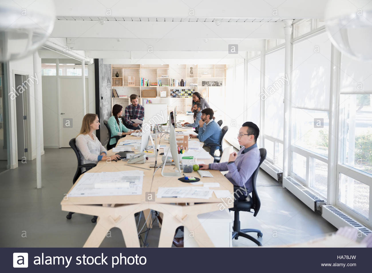 Row of computers office people hi-res stock photography and images - Alamy