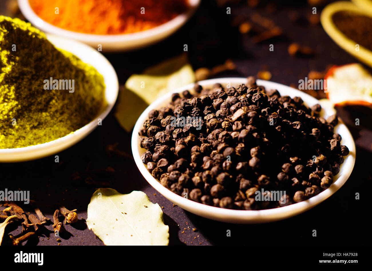 White bowls spread out with different colorful spices inside, beautiful ...