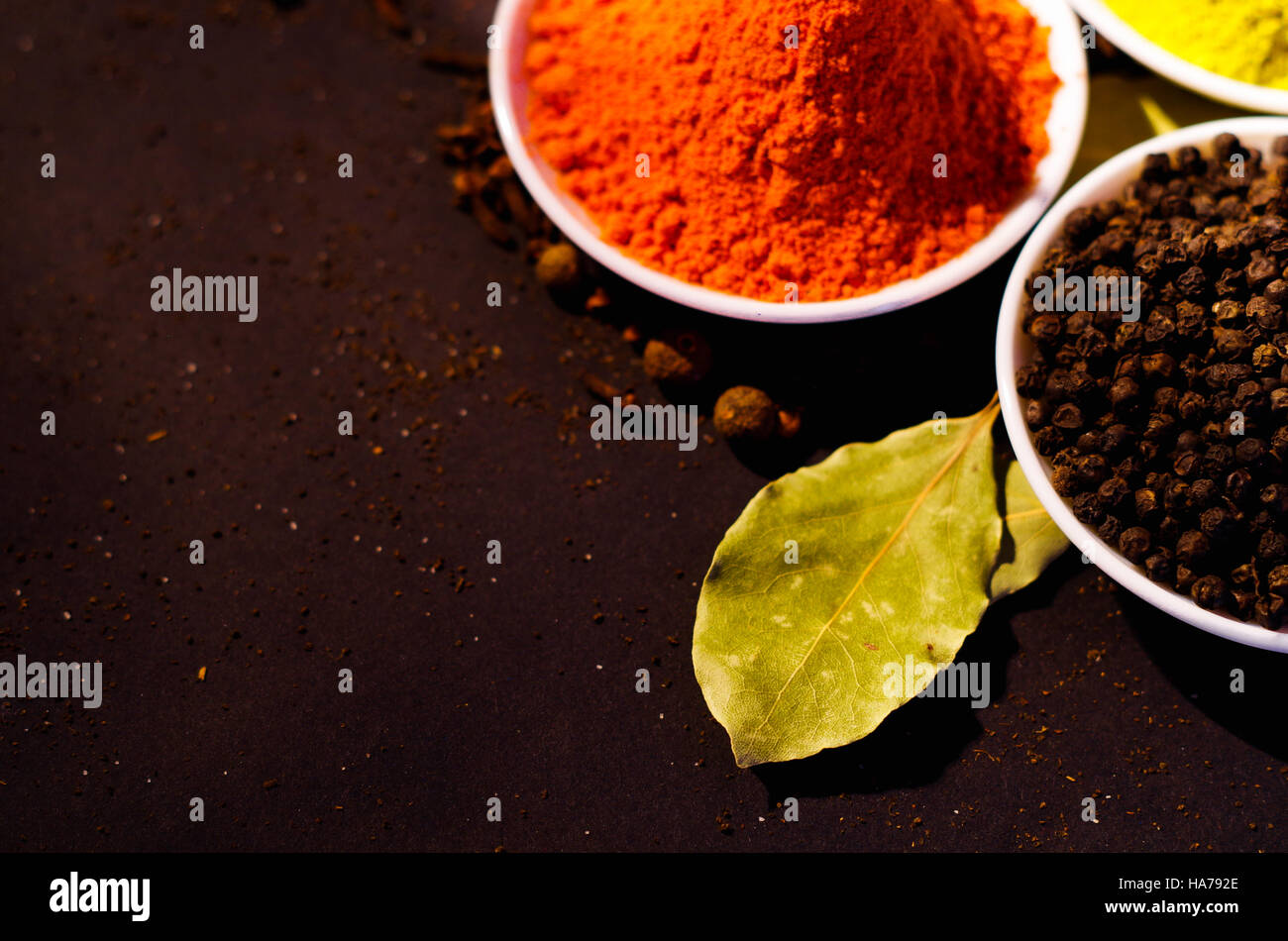 White bowls spread out with different colorful spices inside, beautiful ...