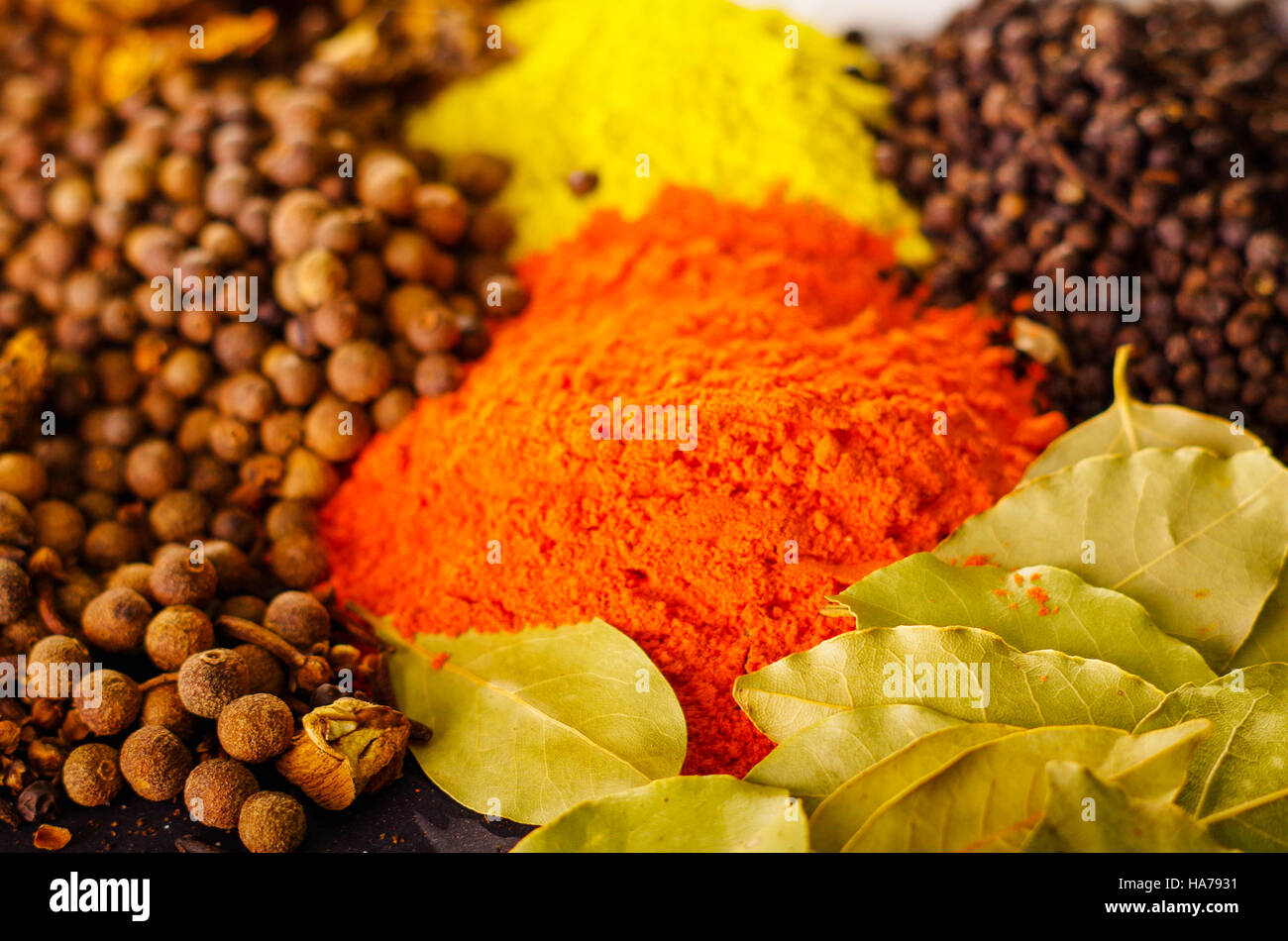 Closeup from above different piles of colorful spices, beautiful rustic ...