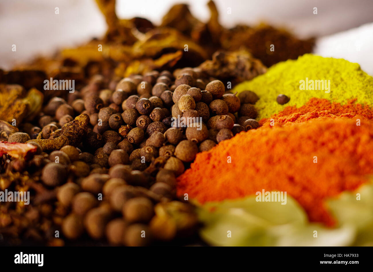 Closeup from above different piles of colorful spices, beautiful rustic ...