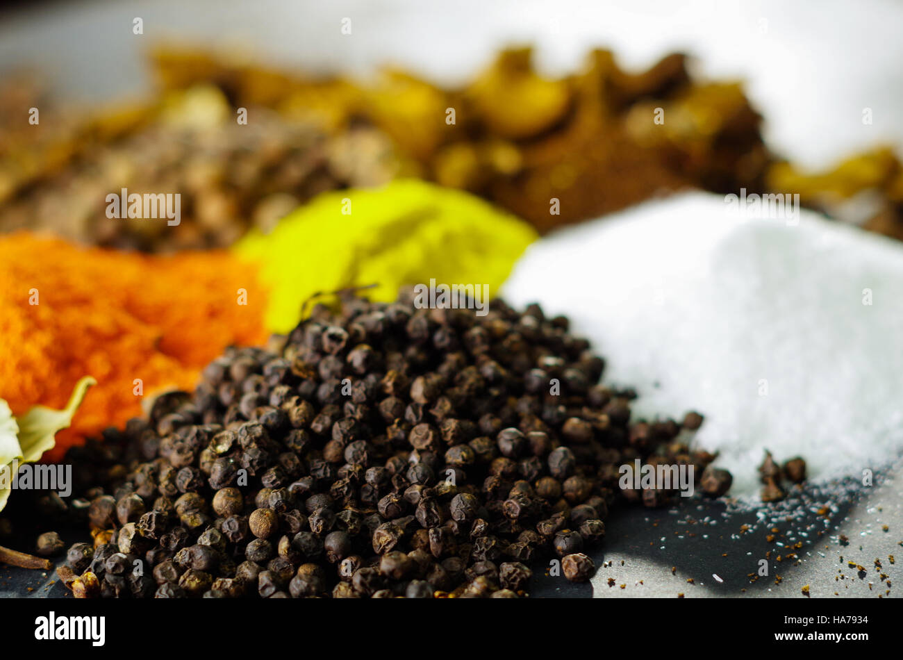 Closeup from above different piles of colorful spices, beautiful rustic ...