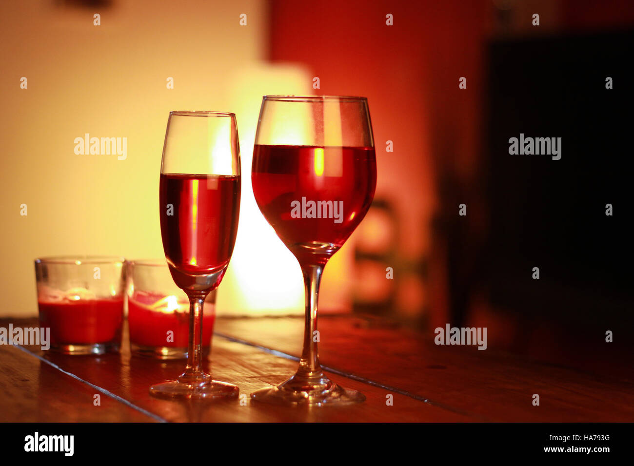 red wine in glass with a living room background and and ambient light ...