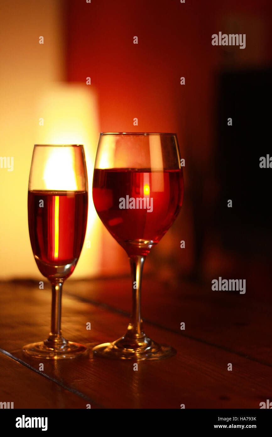 red wine in glass with a living room background and and ambient light ...