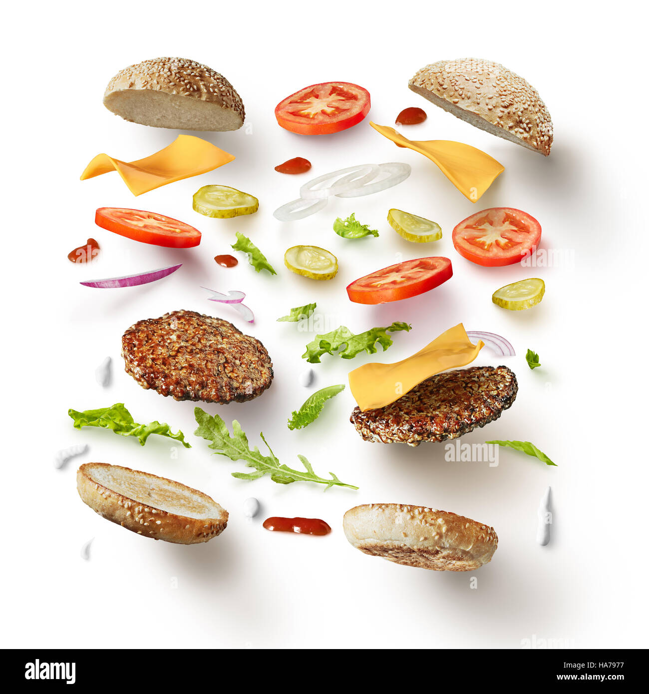 Two burgers with flying ingredients isolated on white background Stock ...