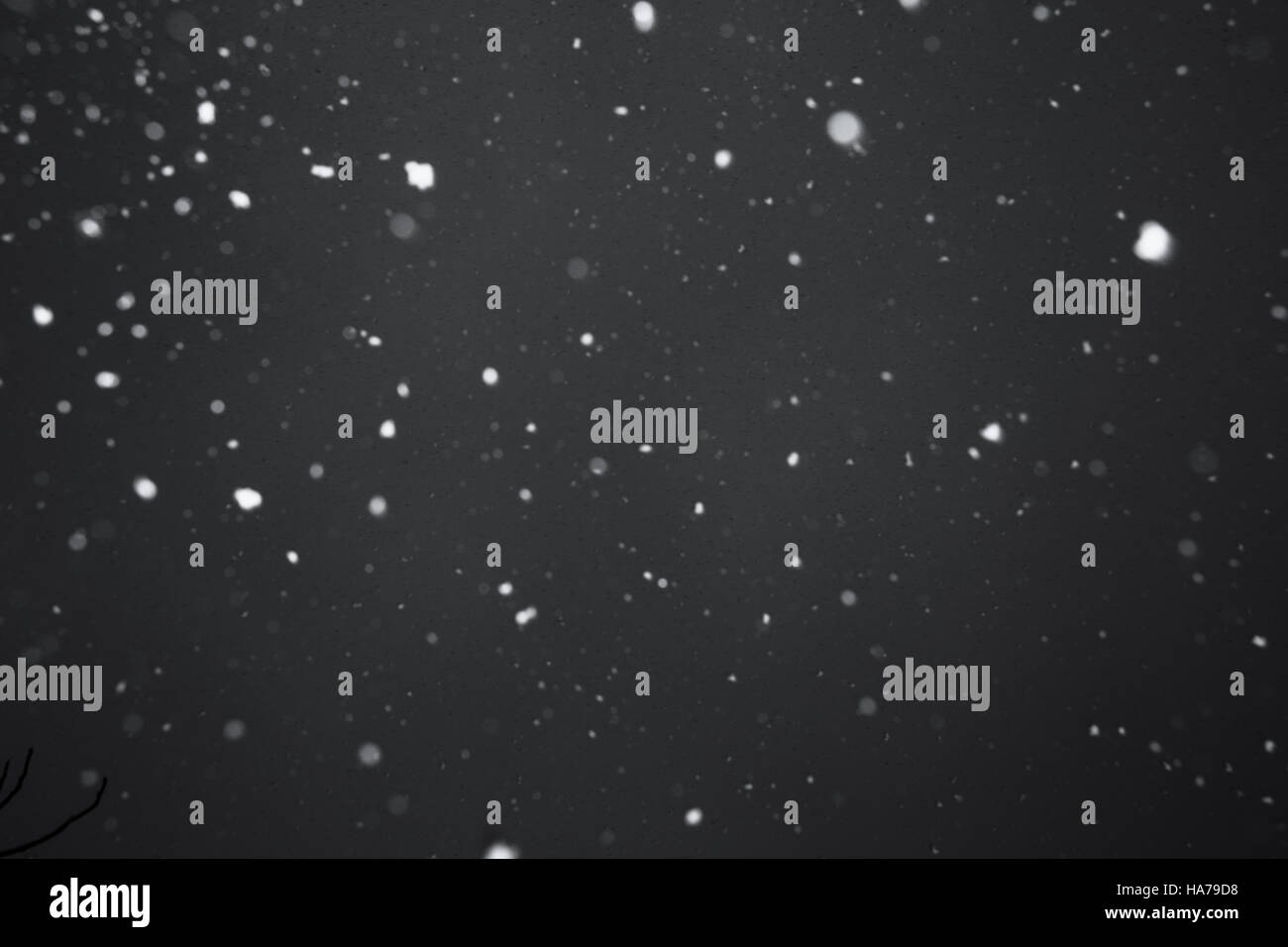 Falling snow on black background Stock Photo - Alamy