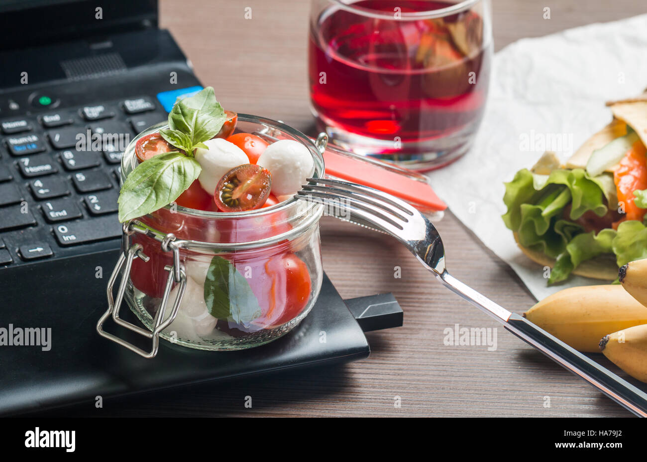 Healthy eating for lunch at work. Food in the office. Caprese salad ...