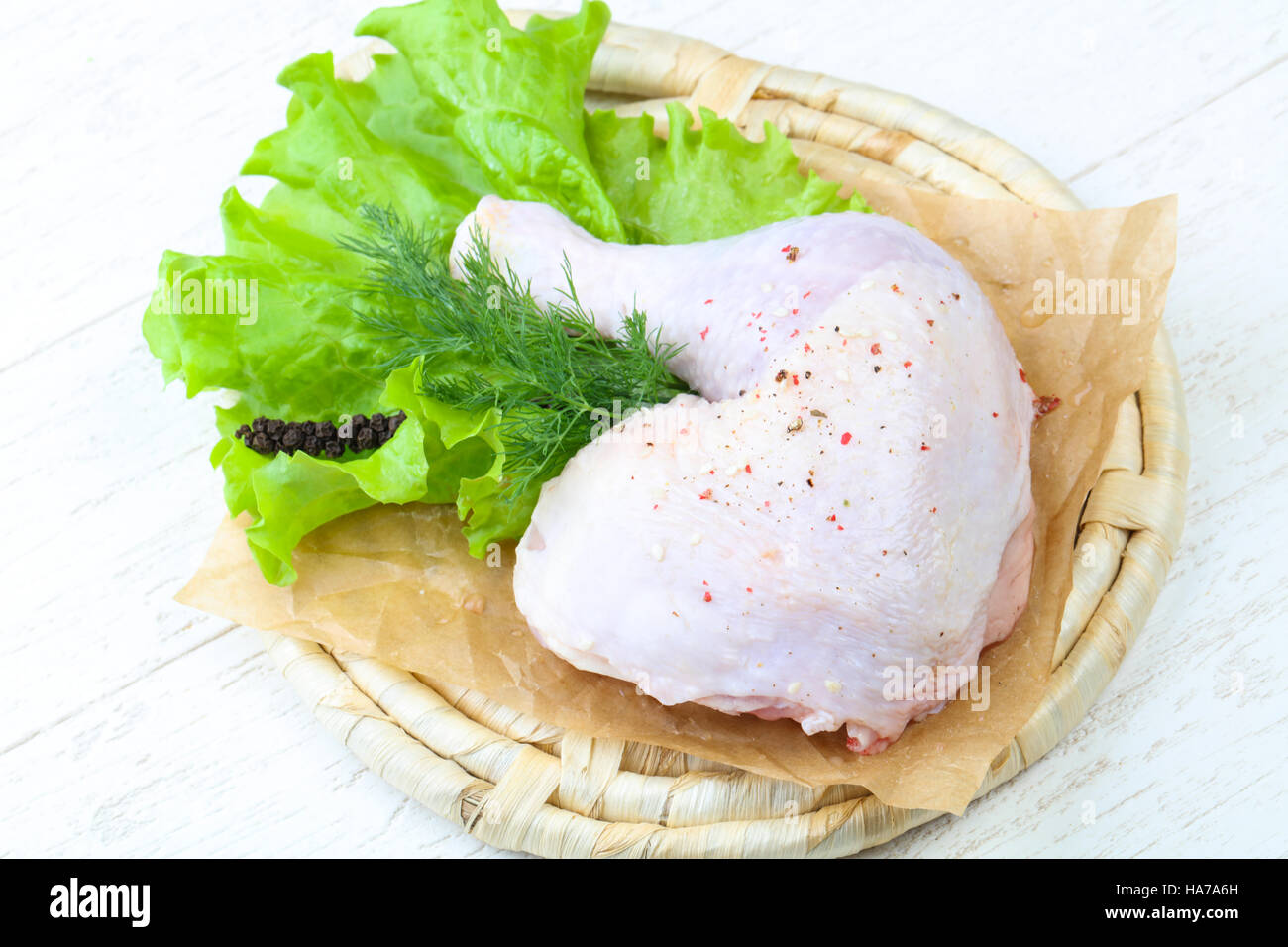 Raw chicken leg with herbs and spices ready for cooking Stock Photo - Alamy