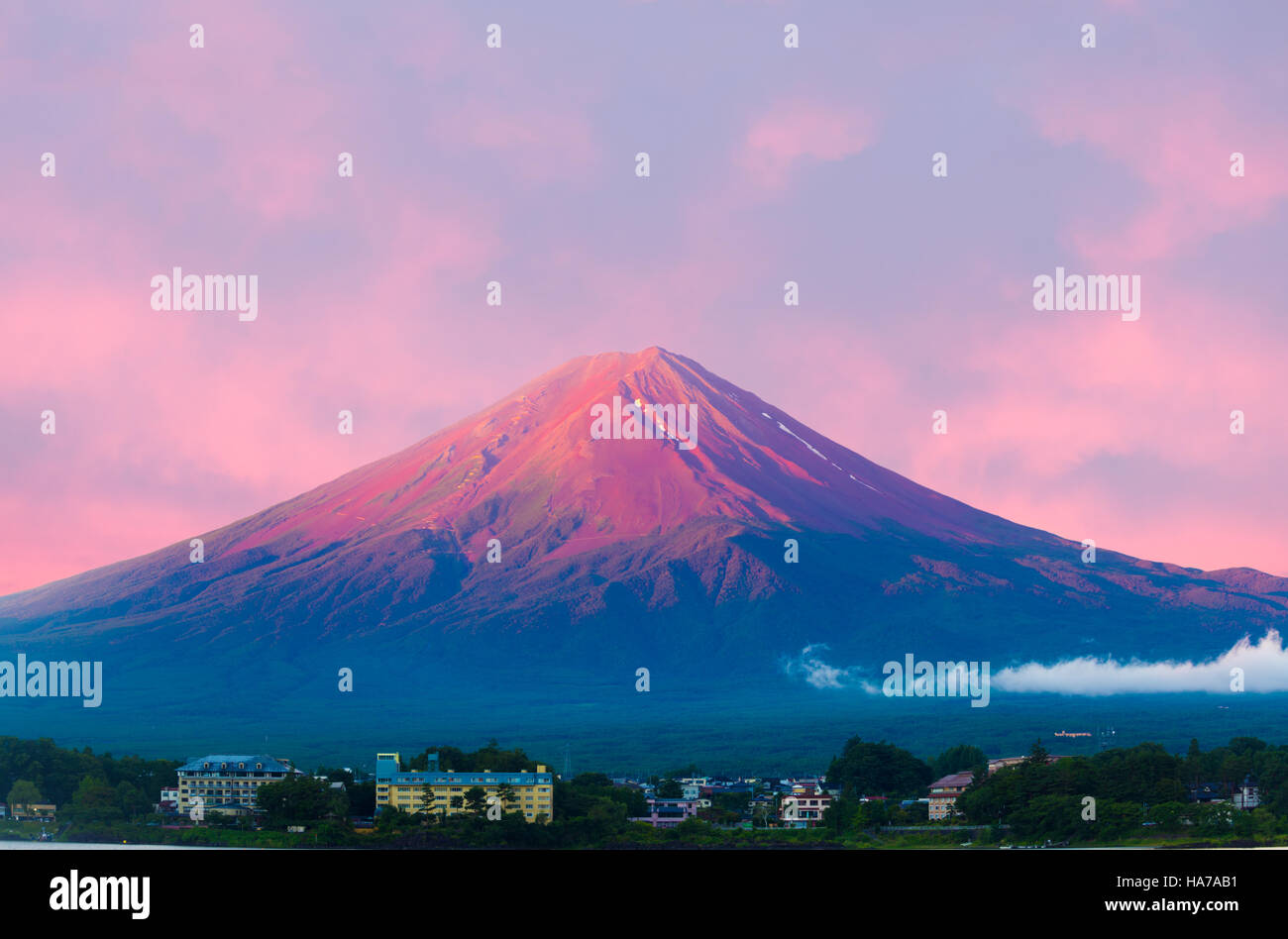 Fiery colorful sky above the red crater cone of Mount Fuji at dawn ...