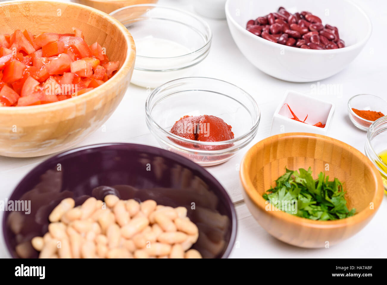 Fresh Food Ingredients On White Wood Kitchen Table Stock Photo - Alamy