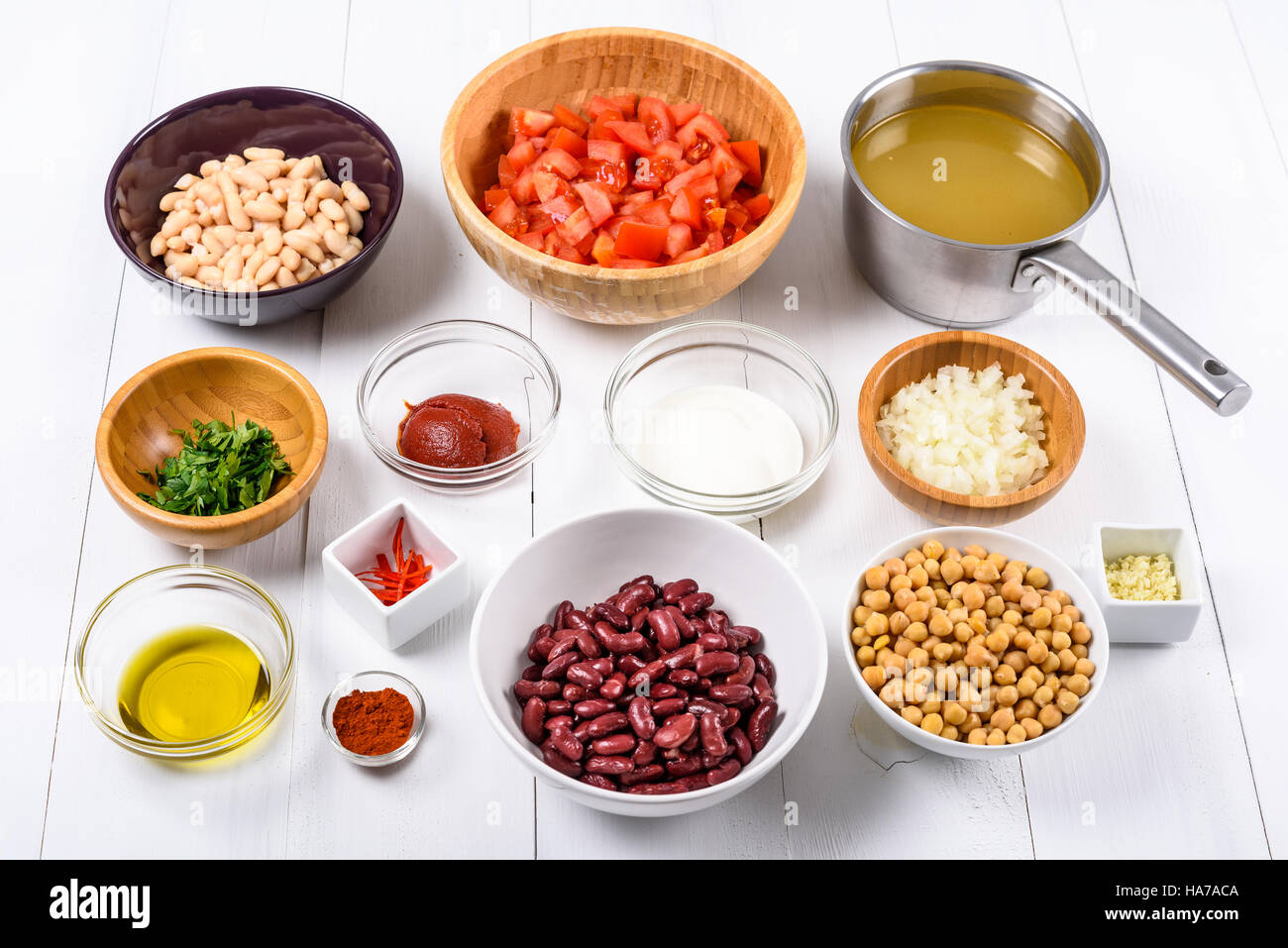 Fresh Food Ingredients On White Wood Kitchen Table Stock Photo - Alamy