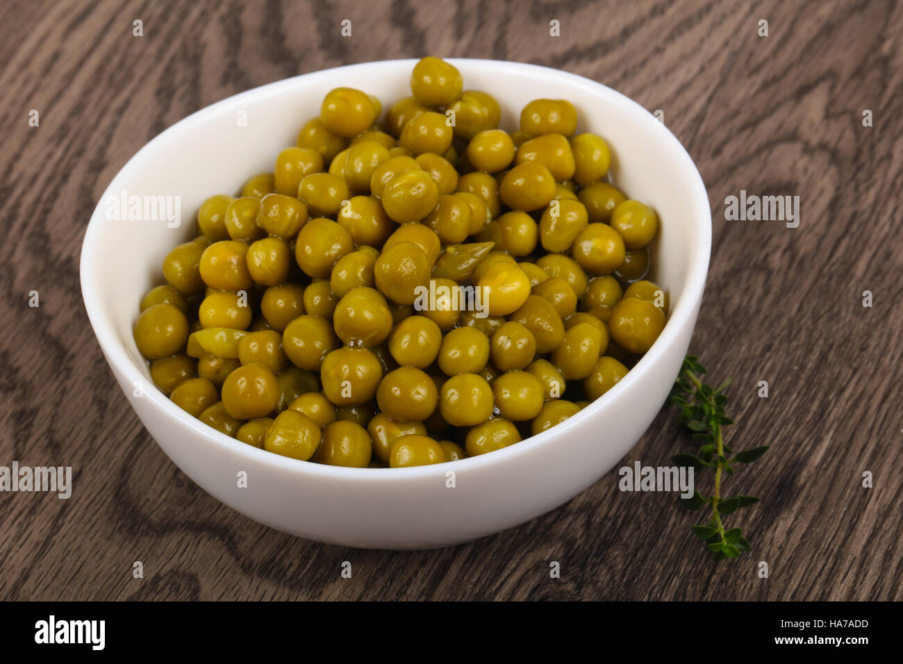 Pickled pea in the plate over wooden background Stock Photo - Alamy
