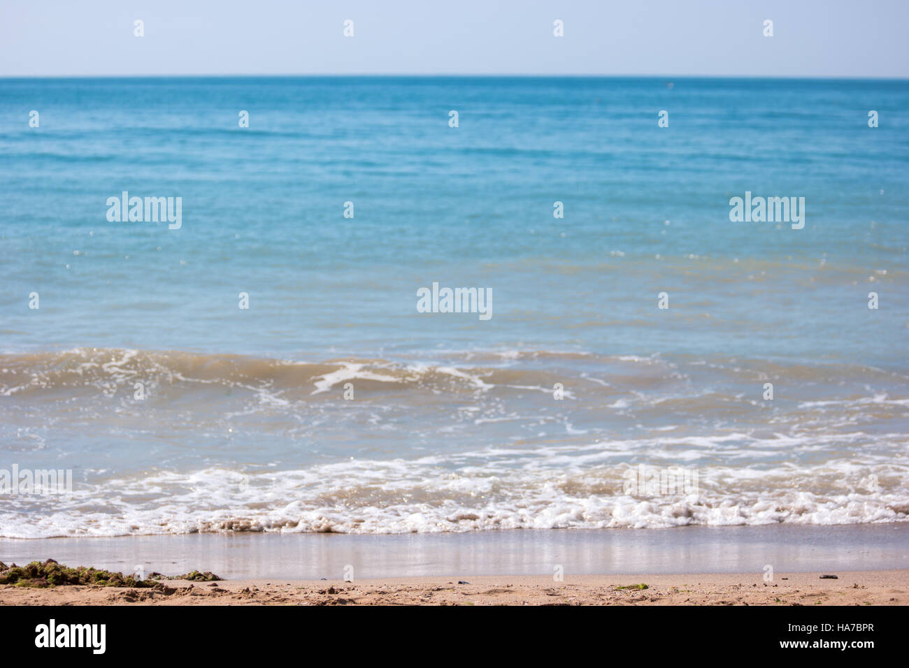 Small wave on seashore Stock Photo - Alamy