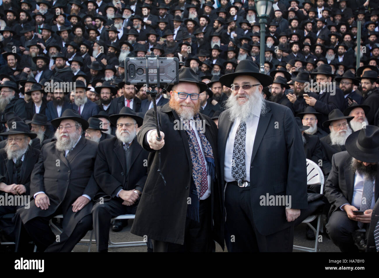 A rabbi taking a selfie at the annual group photos of the Lubavitch ...