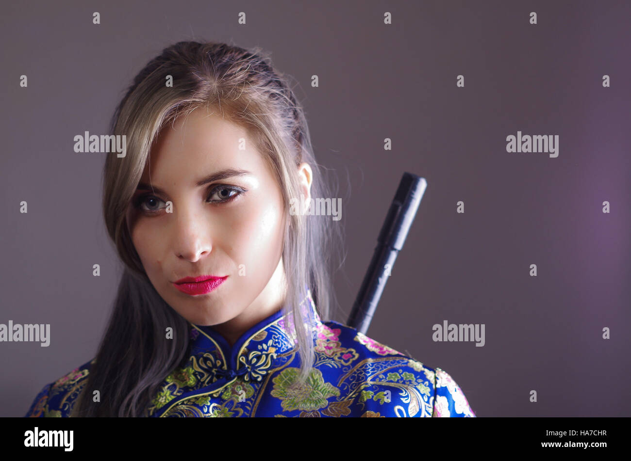 Samurai woman dressed in traditional colorful flower pattern asian silk ...