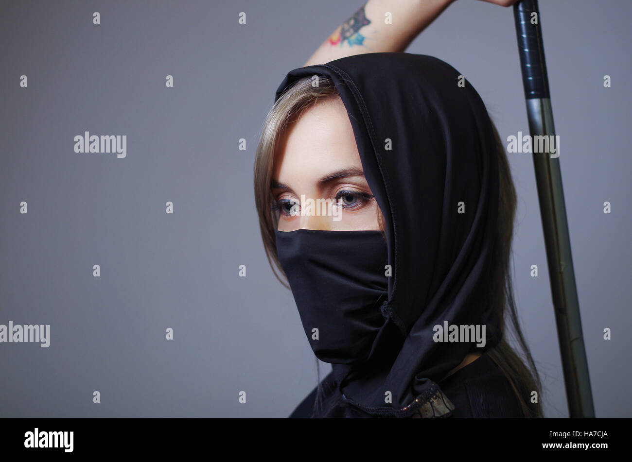 Samurai woman dressed in black with matching veil covering face ...