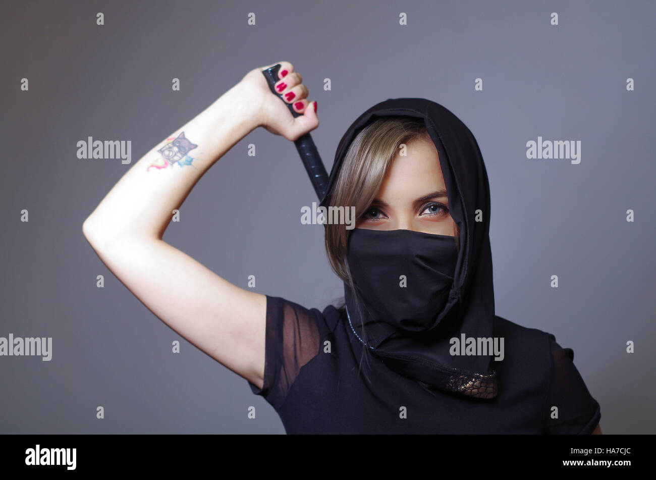 Samurai woman dressed in black with matching veil covering face ...