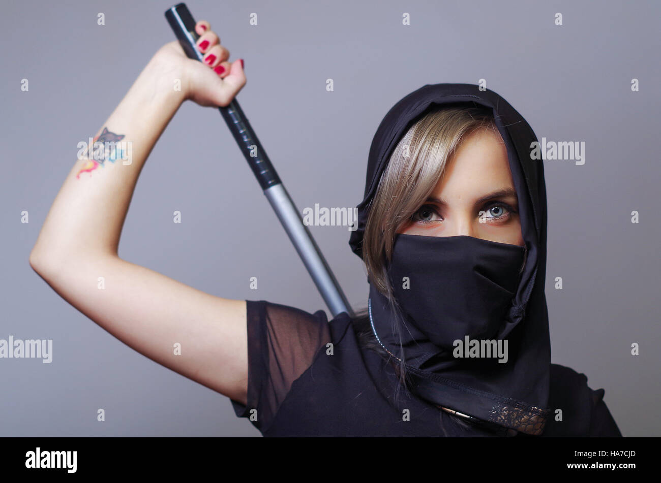Samurai woman dressed in black with matching veil covering face ...