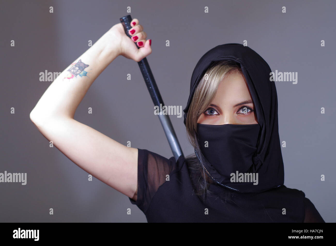 Samurai woman dressed in black with matching veil covering face ...