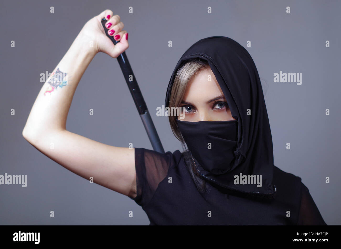 Samurai woman dressed in black with matching veil covering face ...