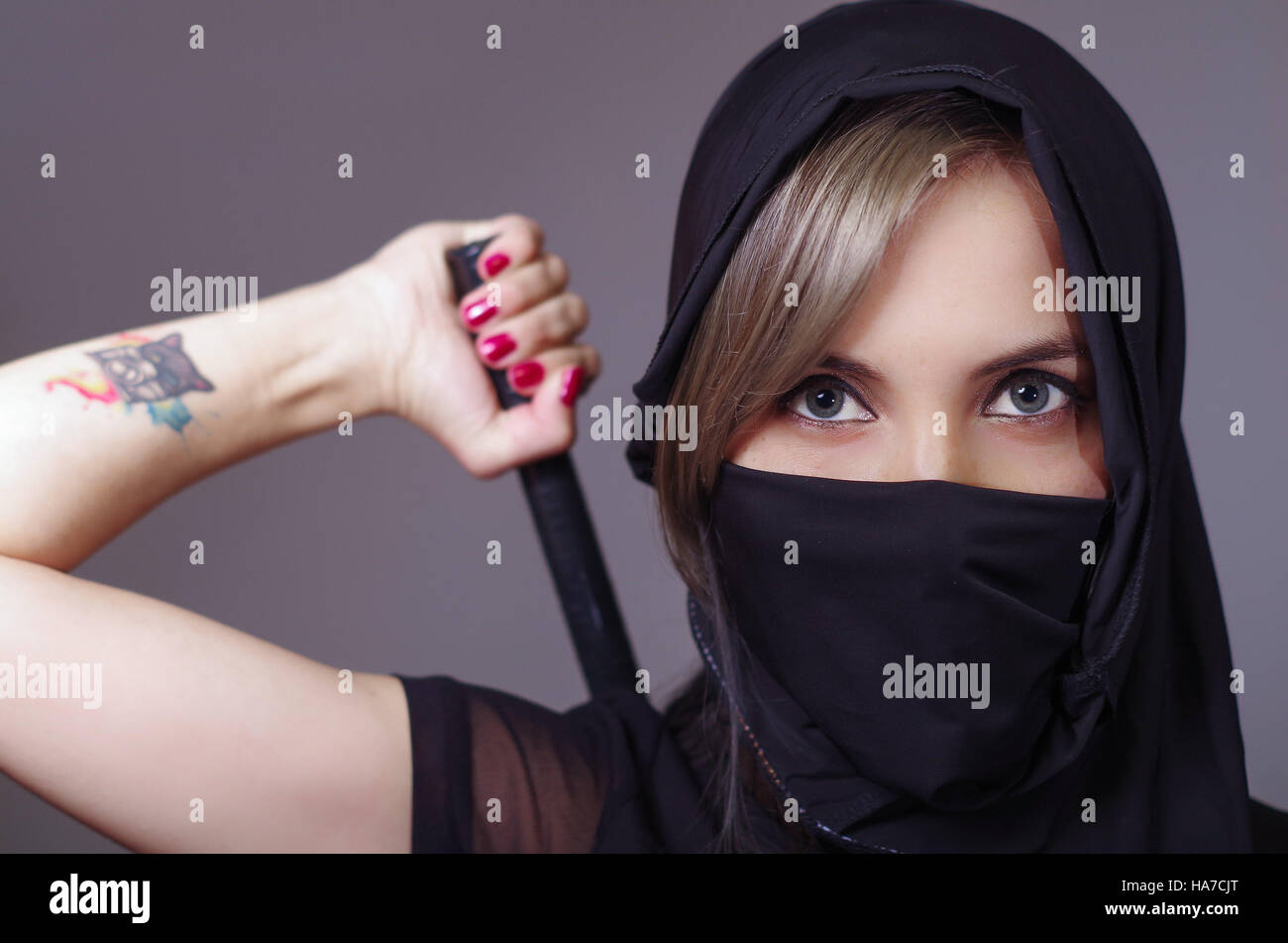 Samurai woman dressed in black with matching veil covering face ...