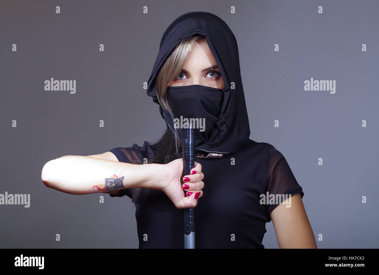 Samurai woman dressed in black with matching veil covering face ...