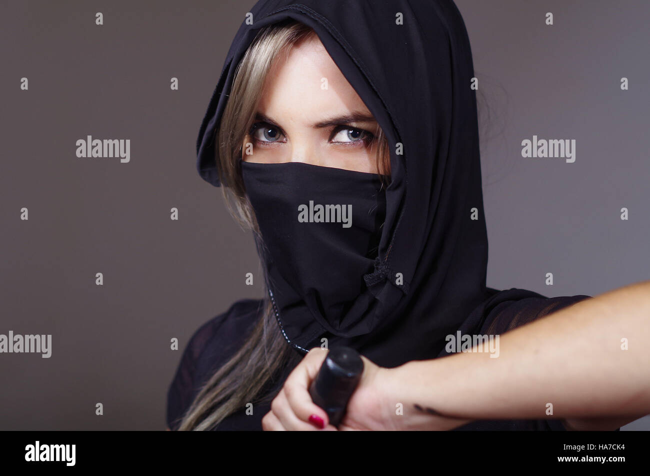 Samurai woman dressed in black with matching veil covering face ...