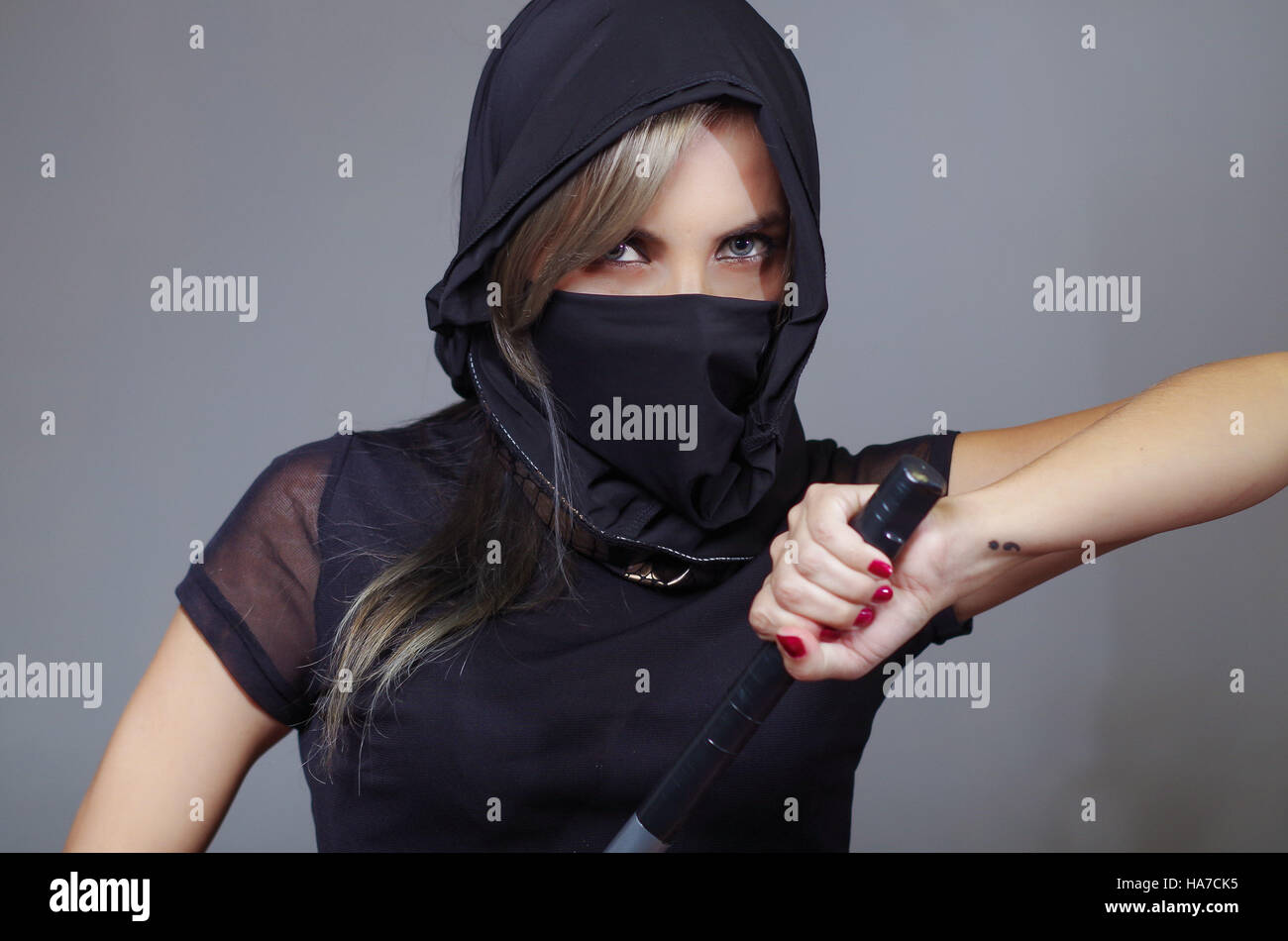 Samurai woman dressed in black with matching veil covering face ...