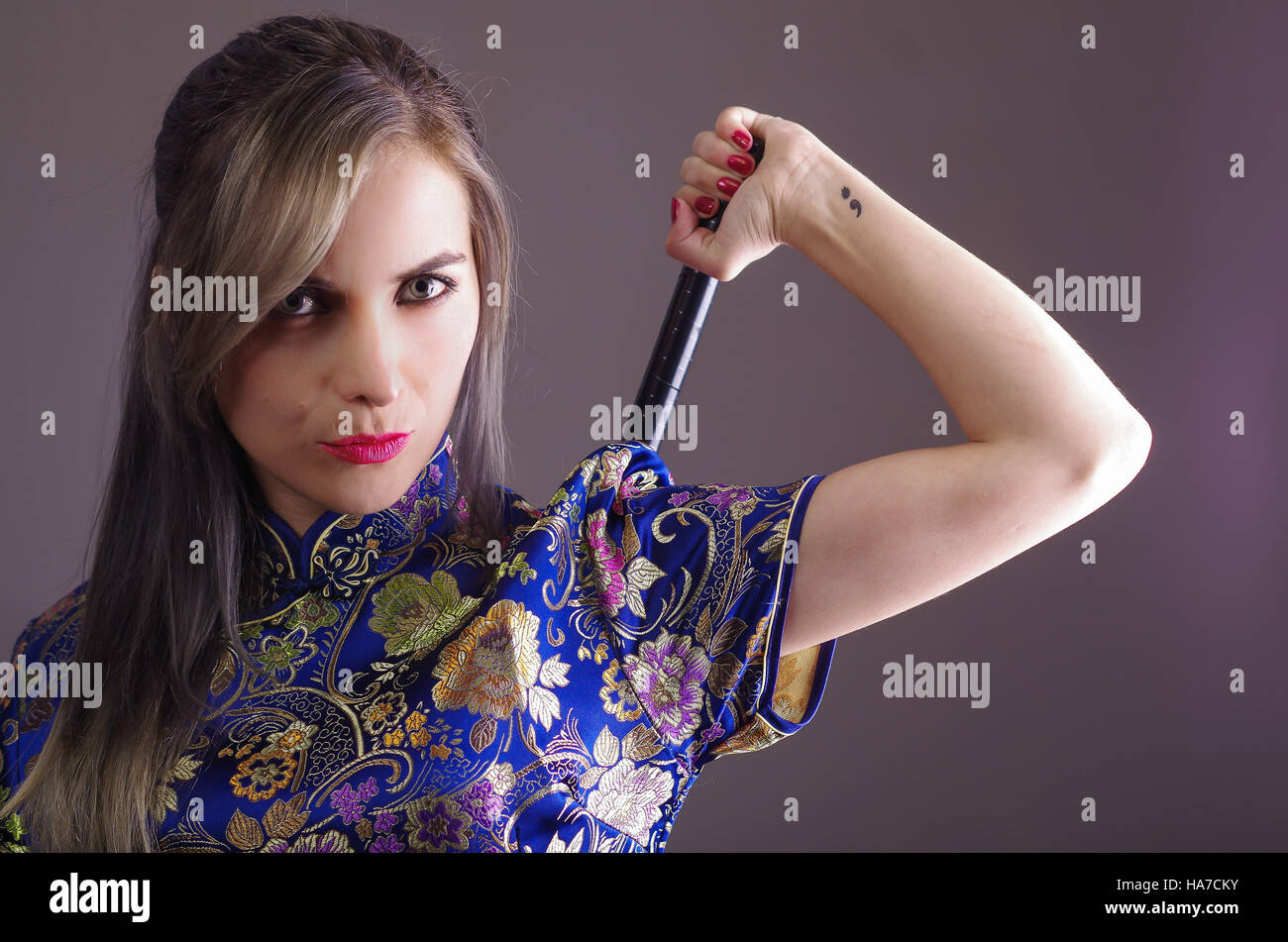 Samurai woman dressed in traditional colorful flower pattern asian silk ...