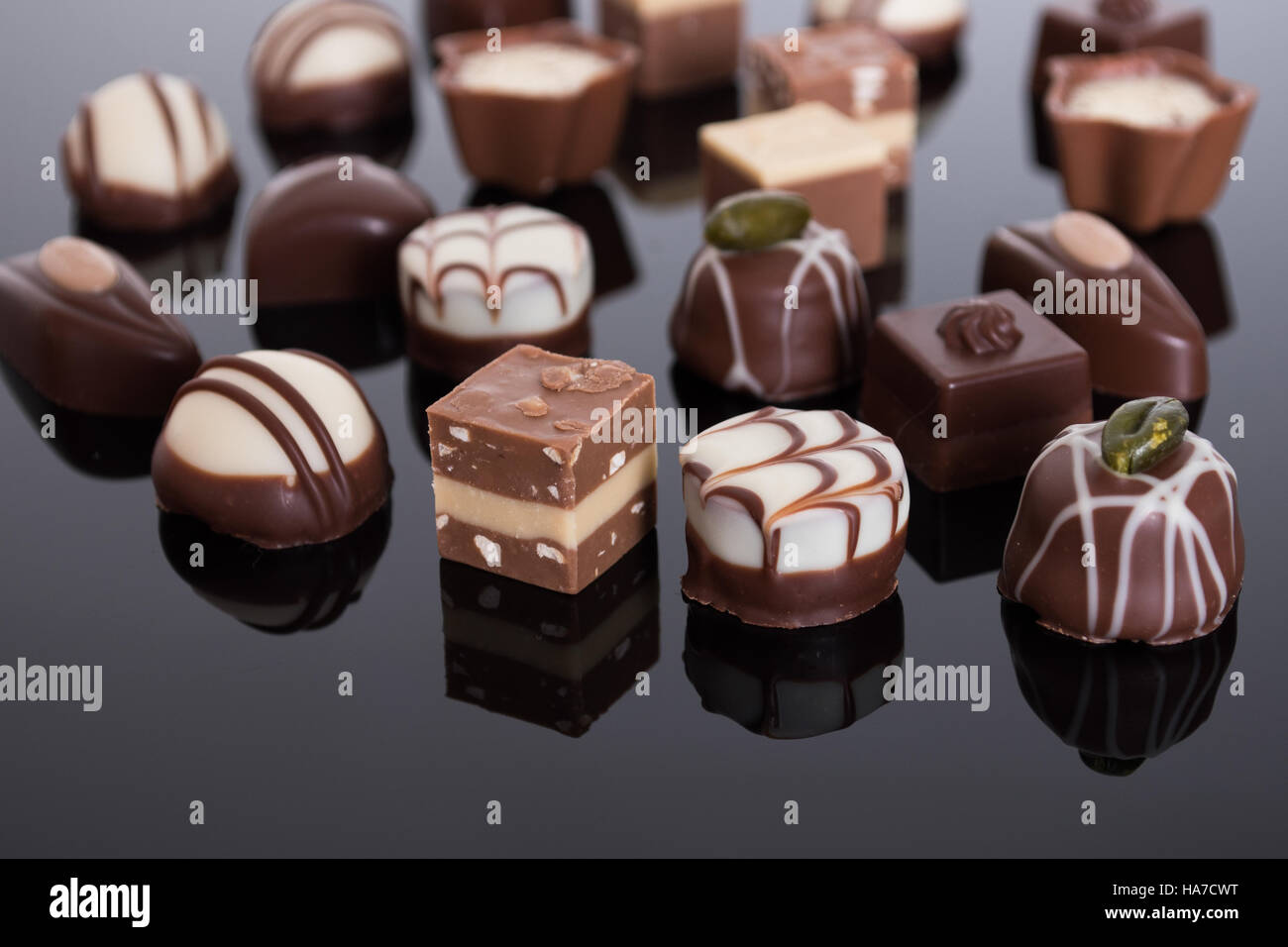 An assortment of fine chocolates in white, dark, and milk chocolate ...