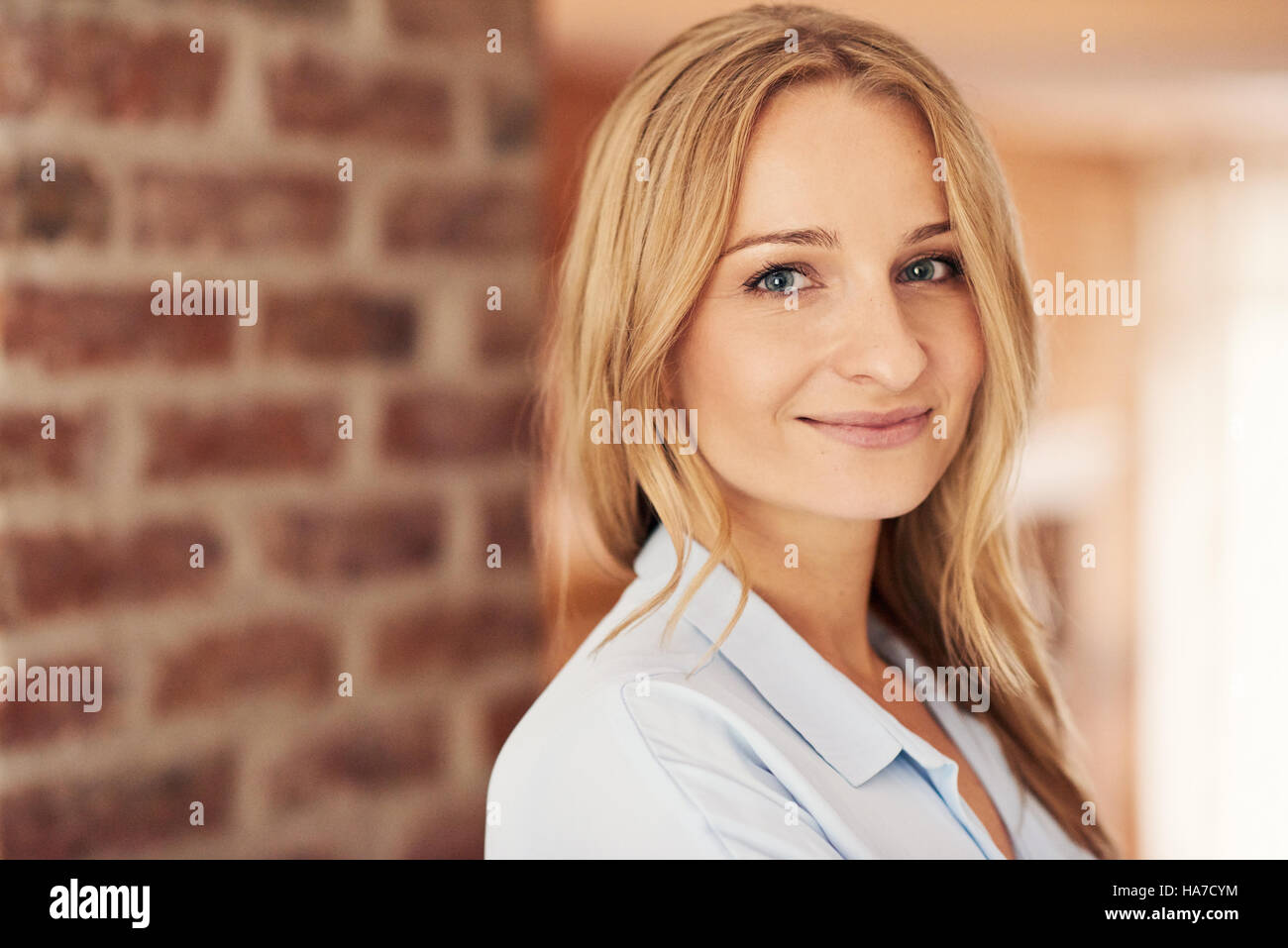 Beautiful young woman content at home Stock Photo - Alamy