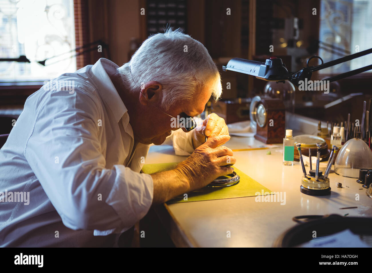 Horologist repairing a watch Stock Photo - Alamy