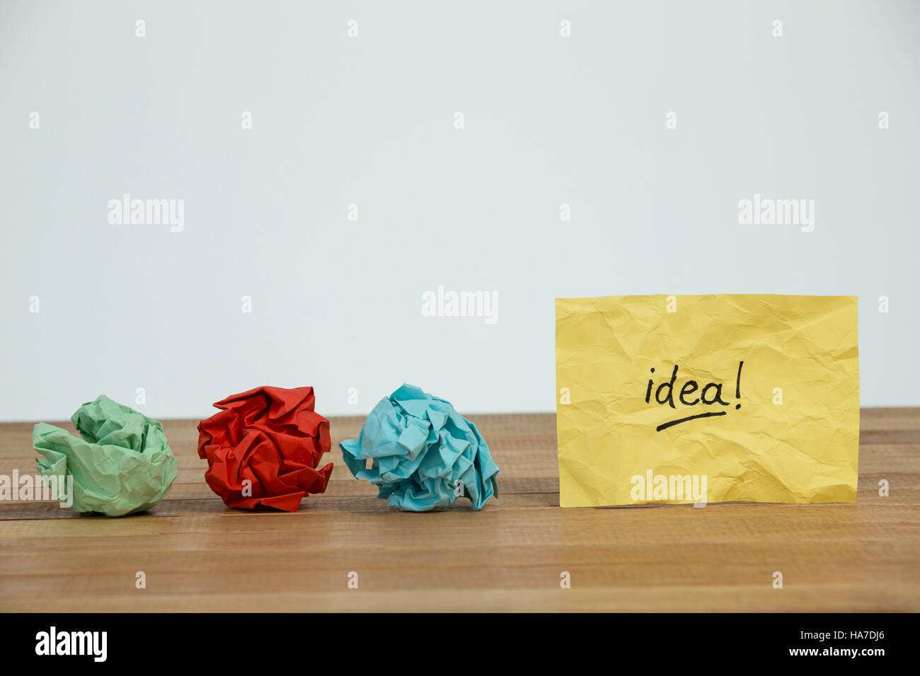 Crumpled paper and idea written on paper Stock Photo - Alamy
