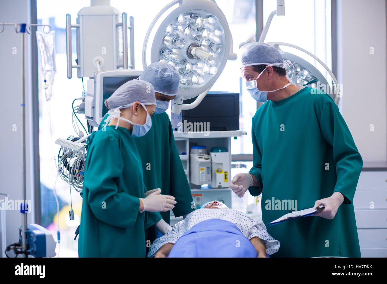 Surgeons performing operation in operation theater Stock Photo - Alamy