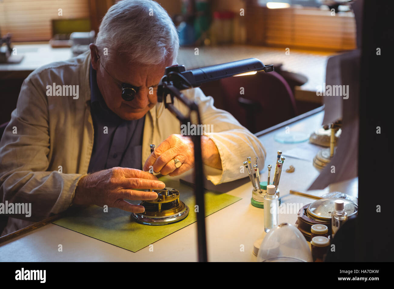 Horologist repairing a watch Stock Photo - Alamy