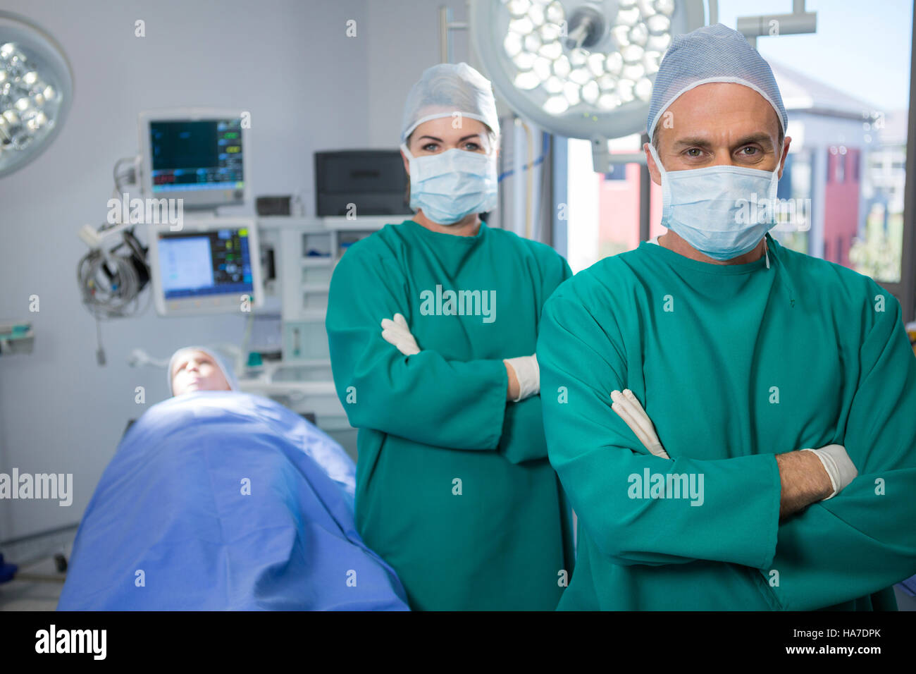 Portrait of surgeons standing in operation theater Stock Photo - Alamy