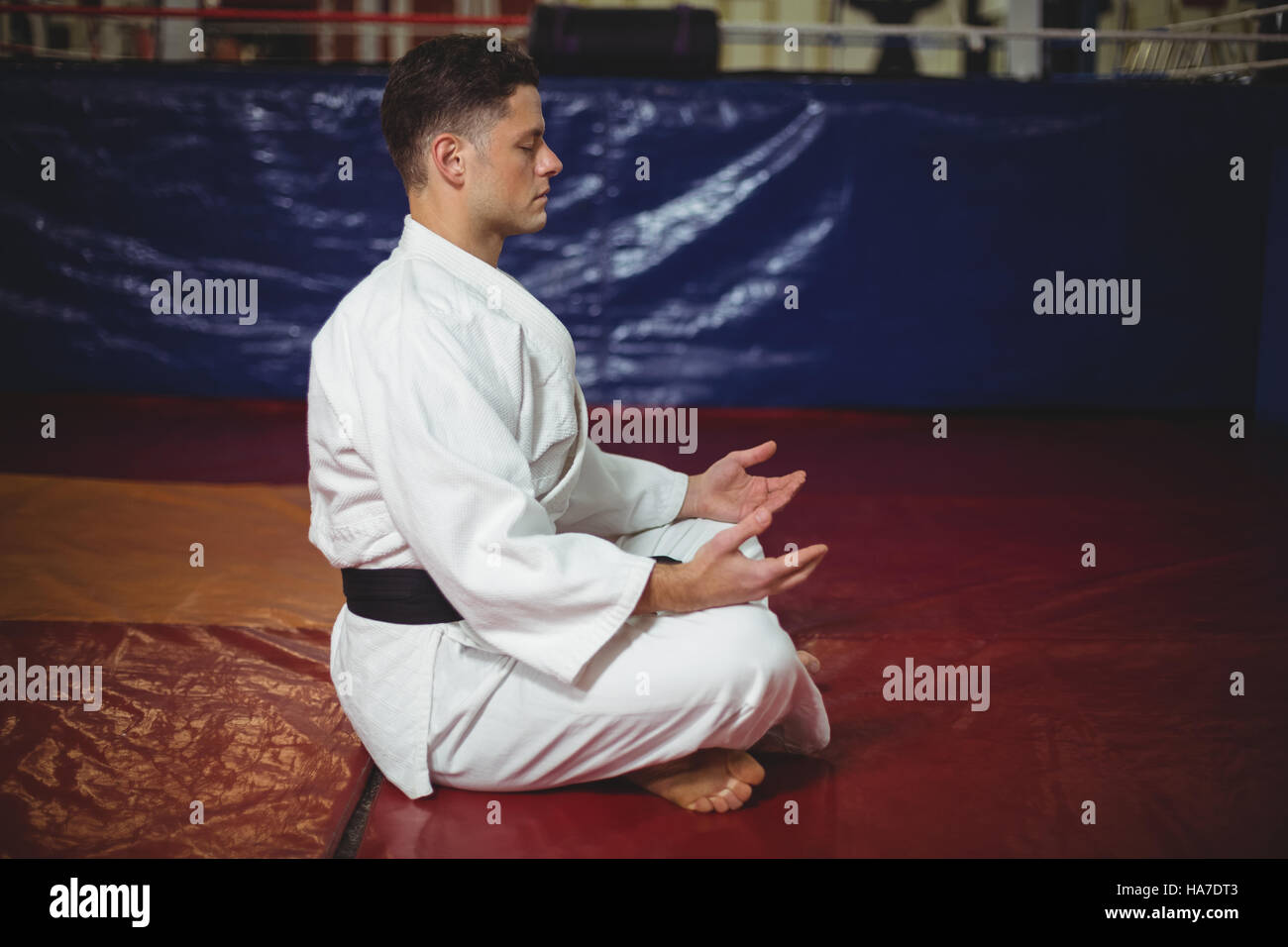 Karate player doing yoga Stock Photo - Alamy