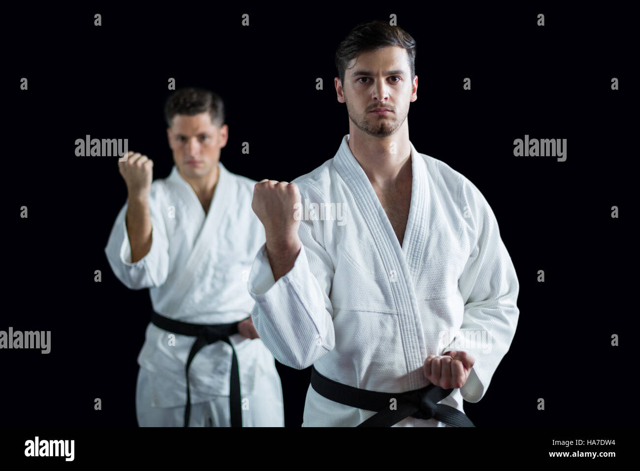 Two karate fighters performing karate stance Stock Photo - Alamy