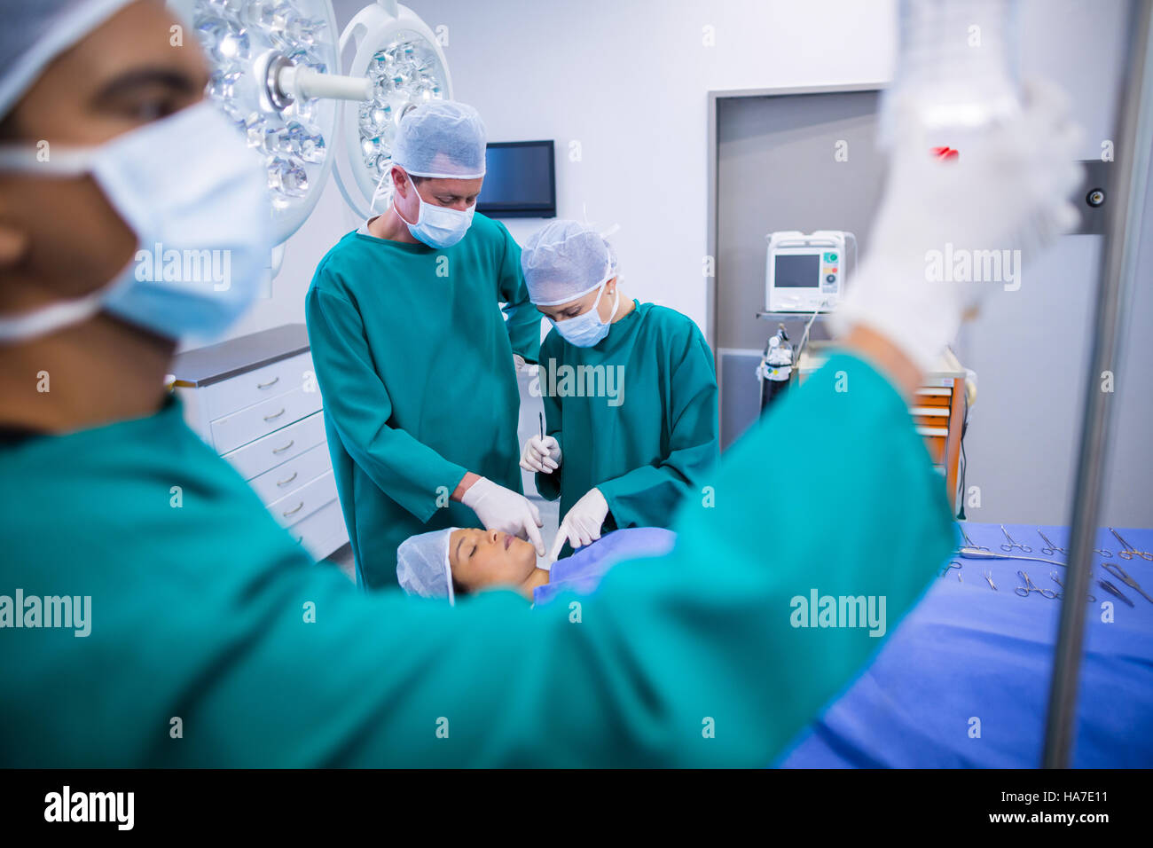 Surgeons performing operation in operation theater Stock Photo - Alamy