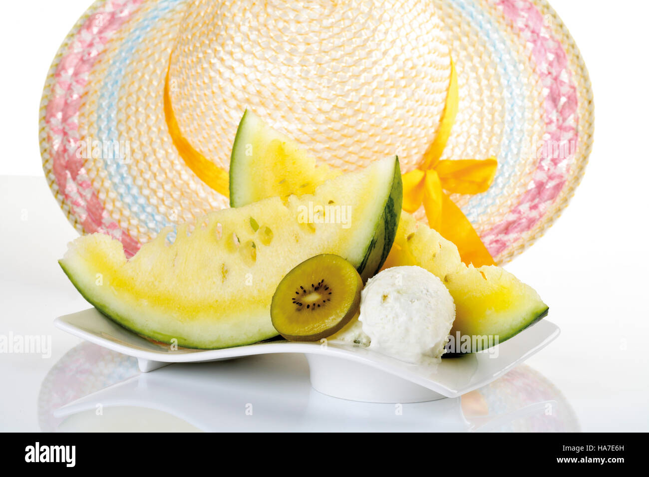 Sun hat, scoops of ice cream and fruit Stock Photo - Alamy