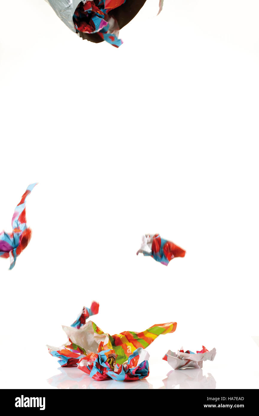 Crumpled-up pieces of paper being emptied out Stock Photo - Alamy