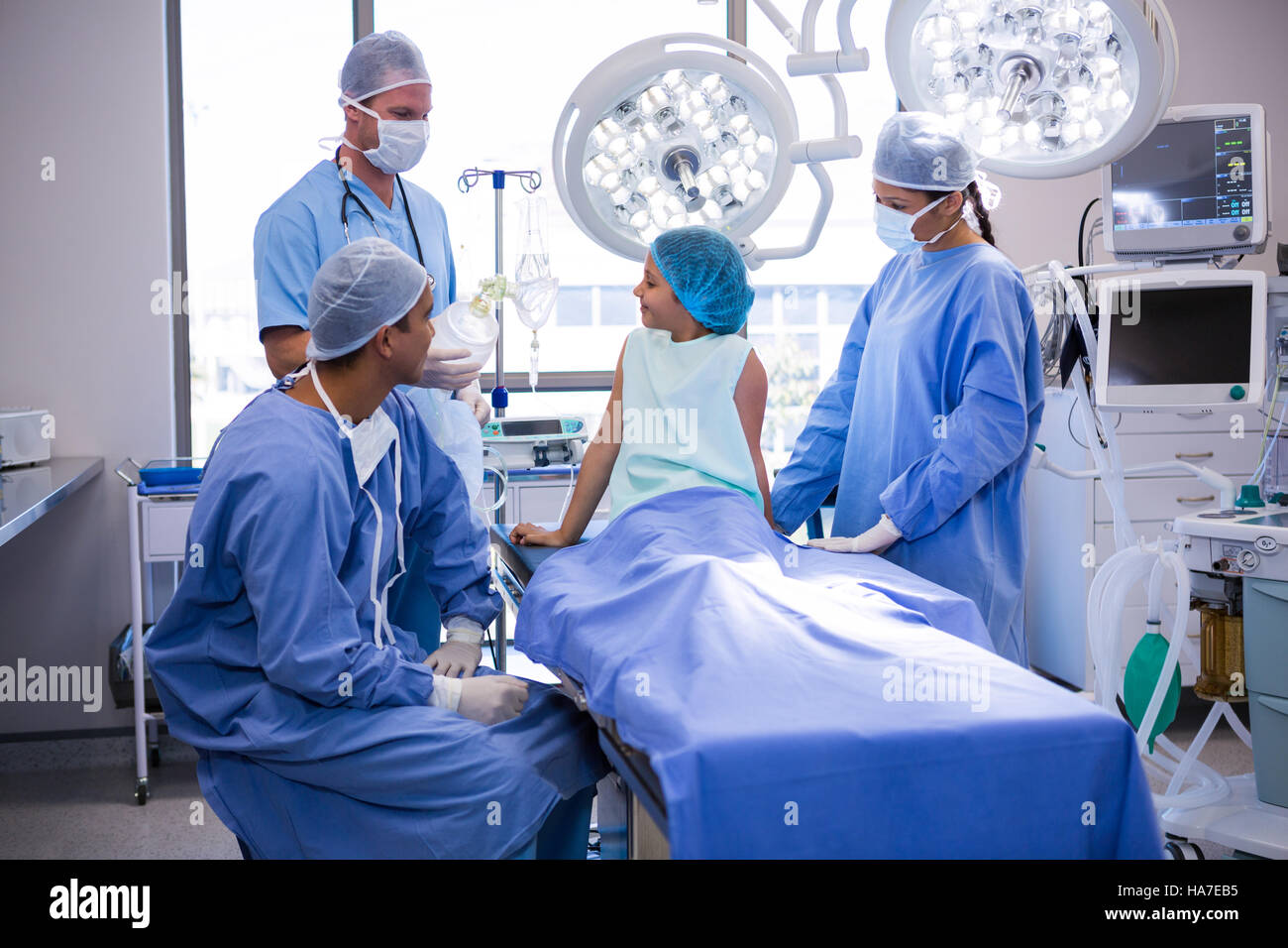 Doctor interacting with patient in operation room Stock Photo - Alamy