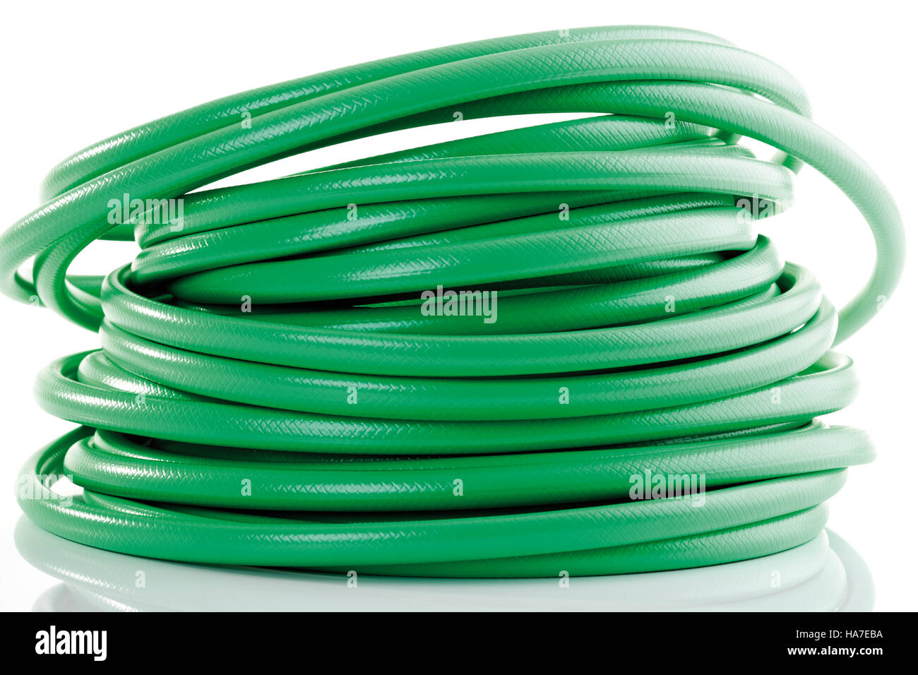 Rolled garden hose Stock Photo - Alamy