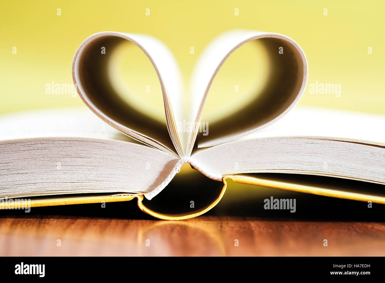 Open book, pages in the shape of a heart Stock Photo - Alamy