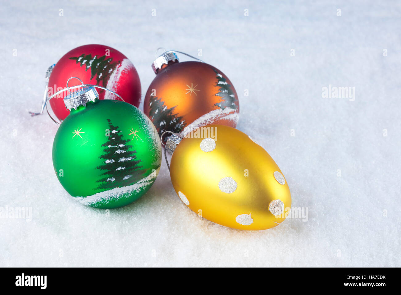 Group of colorful Christmas balls on a white snow background Stock ...