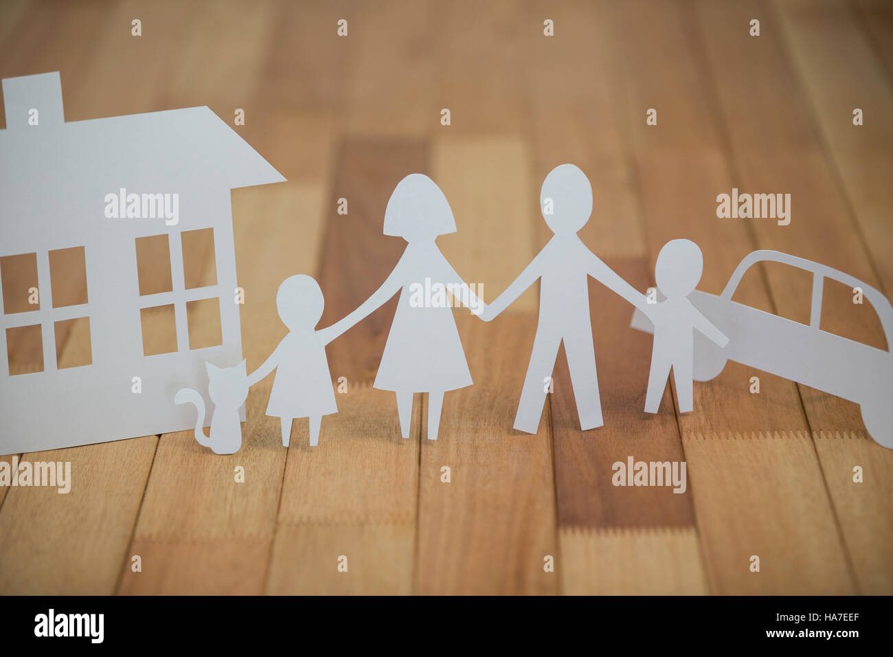 Paper cutout family with house and car Stock Photo - Alamy