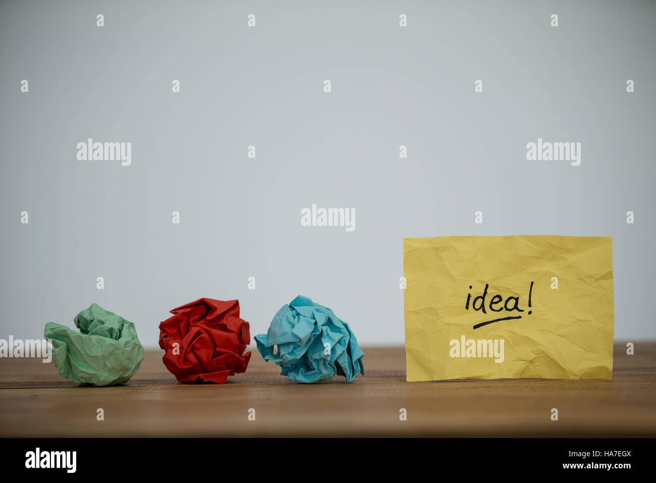 Crumpled paper and idea written on paper Stock Photo - Alamy