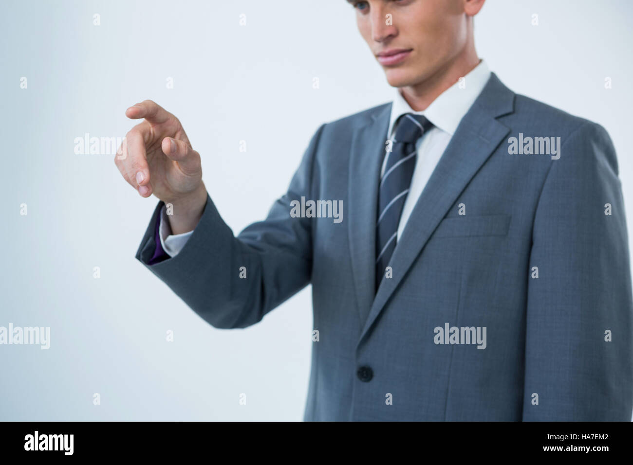Businessman making hand gesture Stock Photo - Alamy