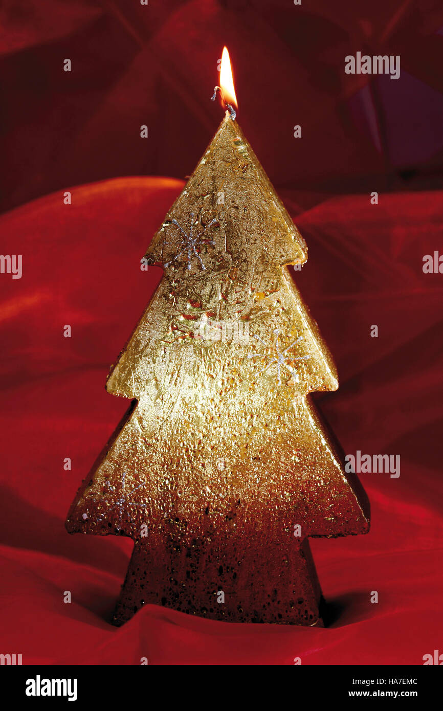 Golden candle, shaped as a Christmas tree Stock Photo - Alamy