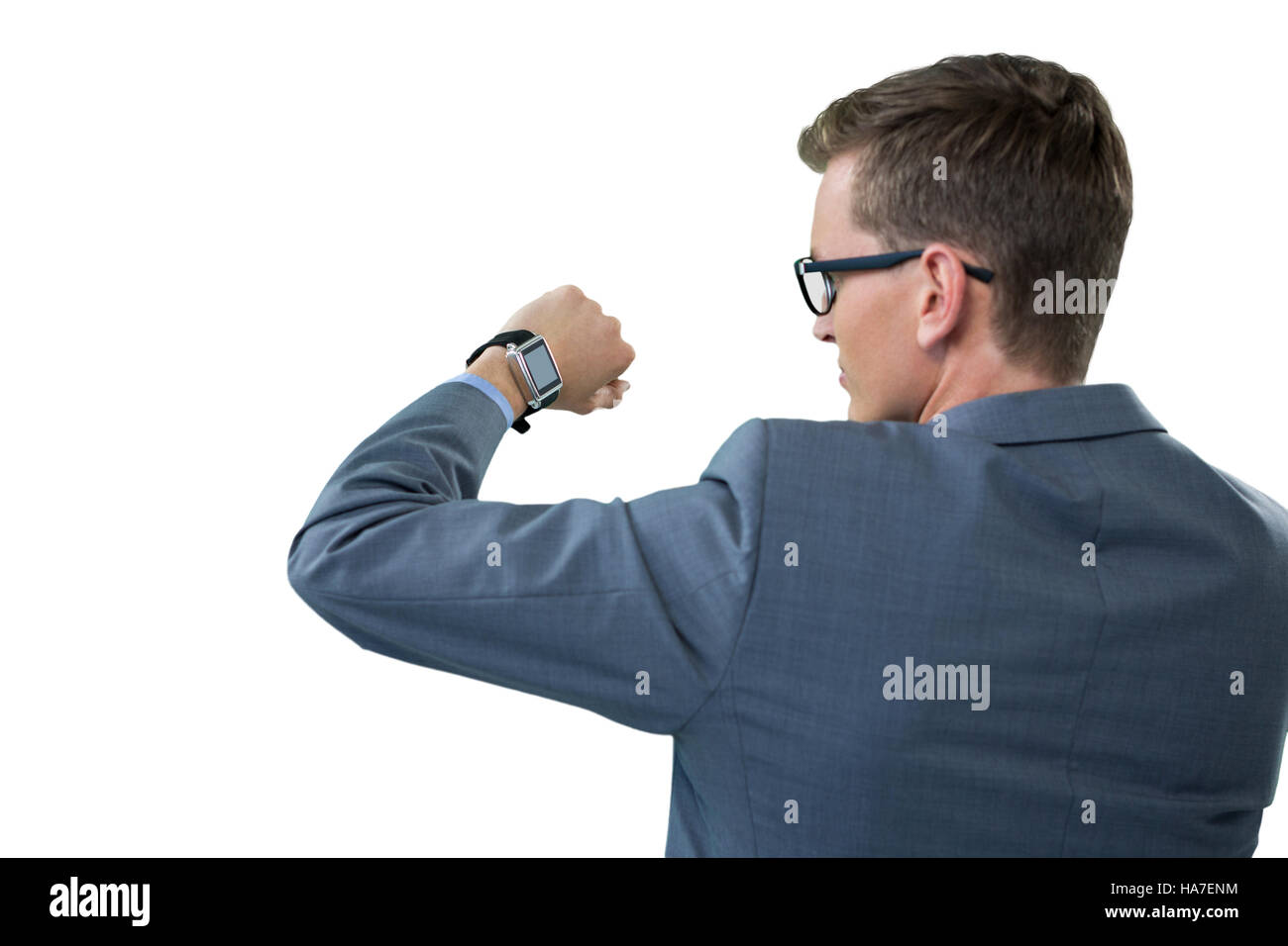 Businessman checking his smart watch Stock Photo - Alamy